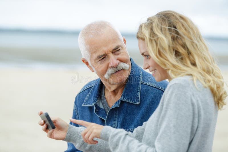 Senior Dad Daughter Checking Mobile Phone Stock Image - Image of ...
