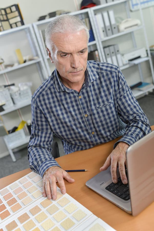 Senior Designer is Ready To Work on a Table Full of Brightly Colored ...