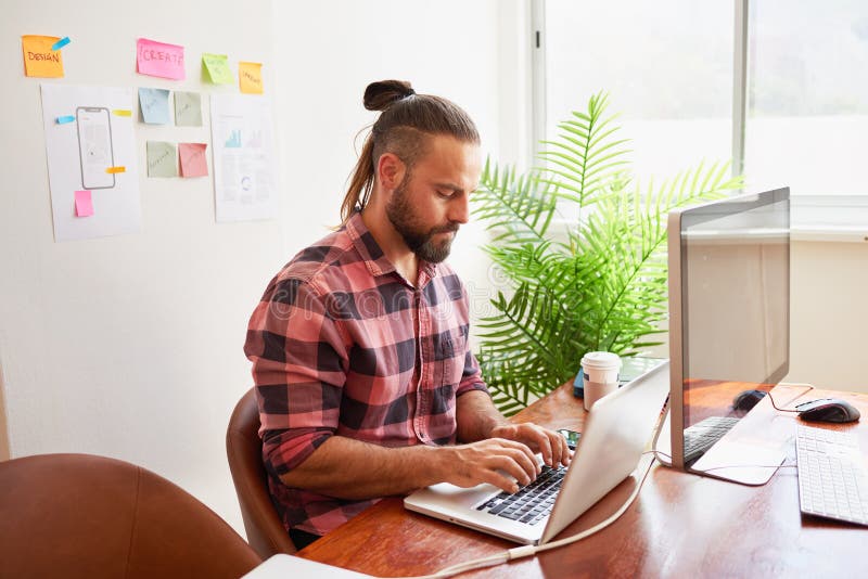 Senior Developer Works in Open Plan Creative Office, Man Bun Hipster ...