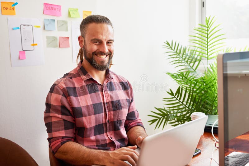 Senior Developer Works in Open Plan Creative Office, Man Bun Hipster ...