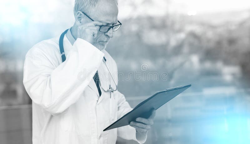 Senior Doctor Reading Notes on Clipboard; Multiple Exposure Stock Image ...