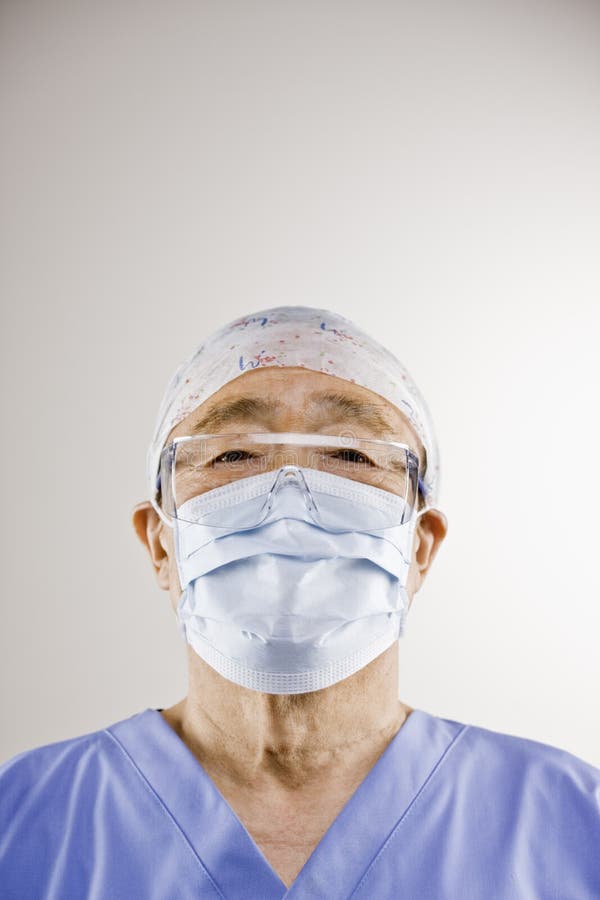 Senior Doctor In Surgical Cap And Mask Stock Photo - Image of color ...