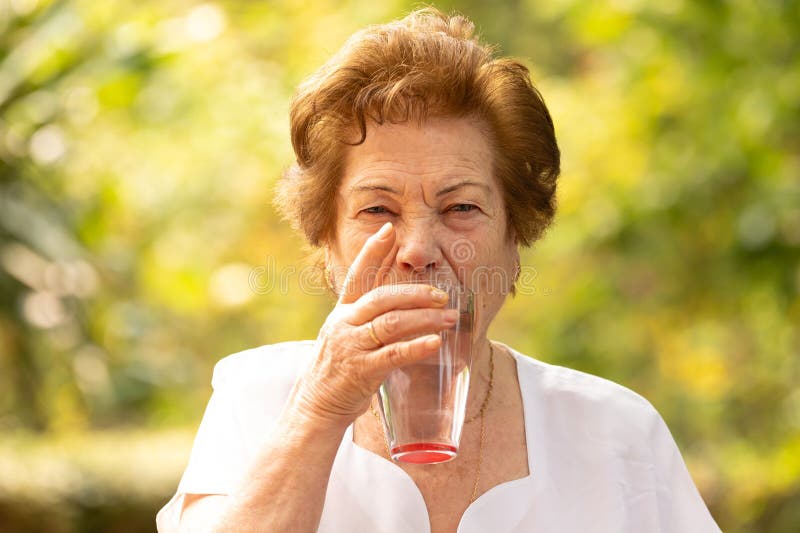Senior Drinking Water in Summer Stock Image - Image of body, elderly ...