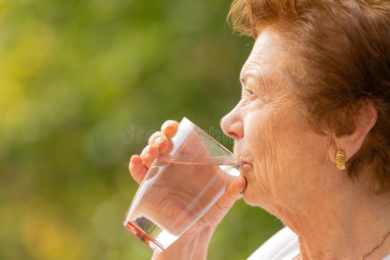 Senior Drinking Water in Summer Stock Photo - Image of water, third ...