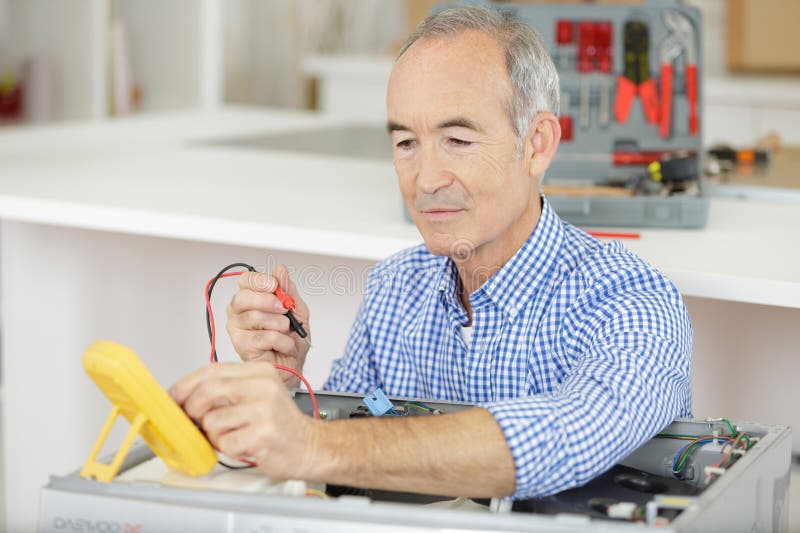 Senior Electrician Working at Home Stock Photo - Image of power ...