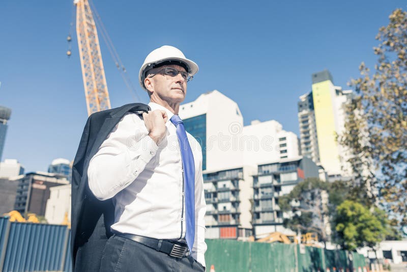 Senior Elegant Builder Man in Suit at Construction Site on Sunny Stock ...