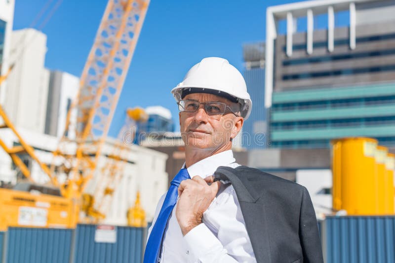 Senior Elegant Builder Man in Suit at Construction Site on Sunny Summer ...