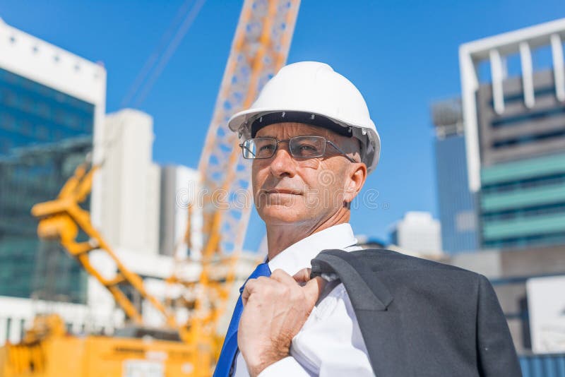Senior Elegant Builder Man in Suit at Construction Site on Sunny Summer ...