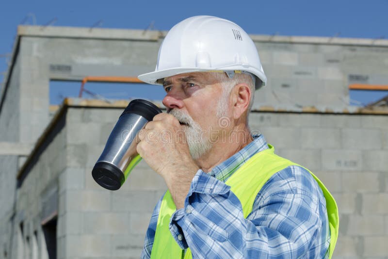 Senior Engineer Man in Suit and Helmet Outdoor Having Coffee Stock ...