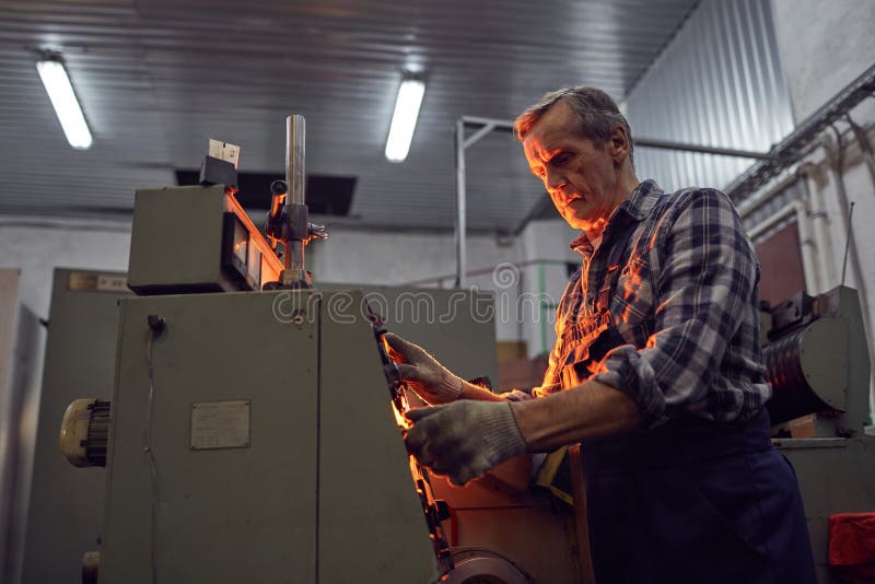 Engineer working on lathe stock photo. Image of steel - 166371220