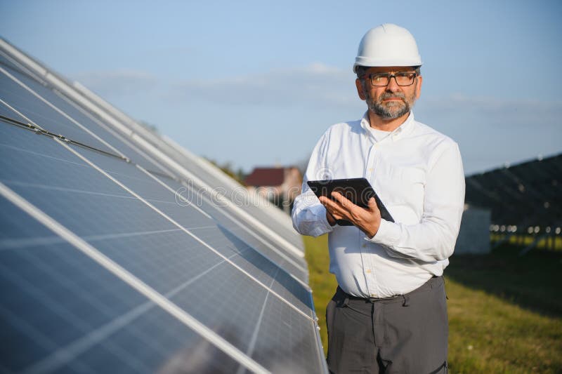 Senior Engineer Working on Solar Panel Farm. the Concept of Green ...