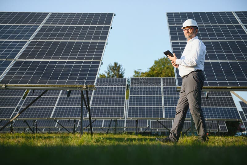 Senior Engineer Working on Solar Panel Farm. the Concept of Green ...