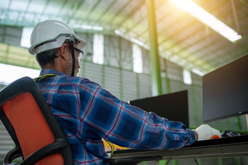 Senior Engineering Working in the Office with the Computer for Using ...