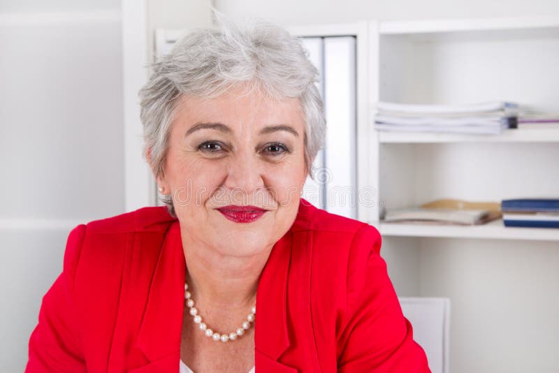 Senior Expert in Red at Workplace Stock Image - Image of female ...