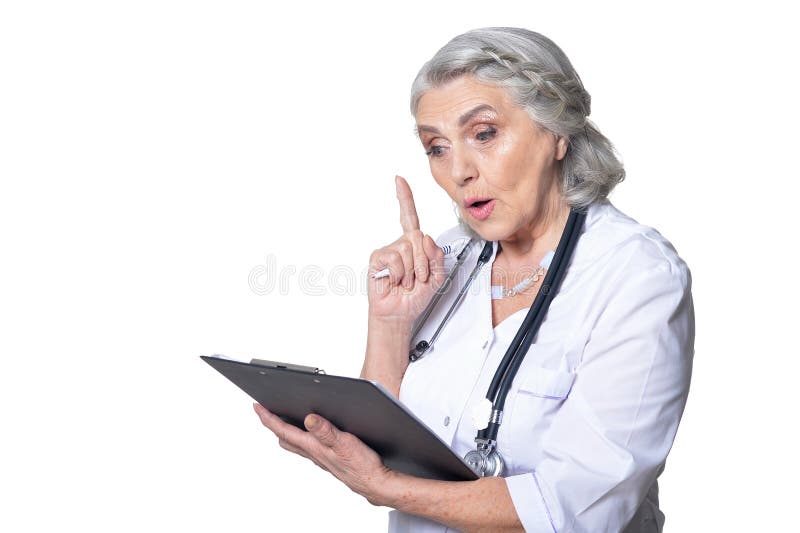Senior Female Doctor with Folder Posing on White Background Stock Photo ...