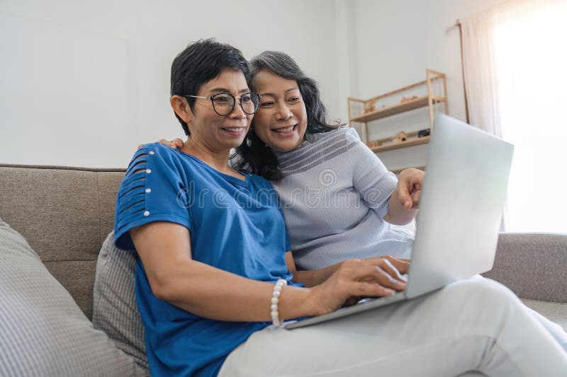 Senior Female Friend Using Digital Laptop Together Stock Image - Image ...