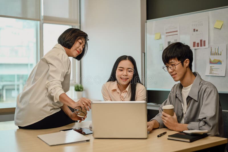 Senior Female Manager Helping and Explaining Work Process To New ...