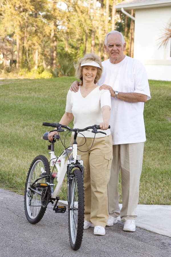 Seniors couple biking stock photo. Image of exercise - 15114074