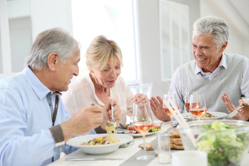 Senior Friends Having Lunch at Home Stock Image - Image of women, lunch ...