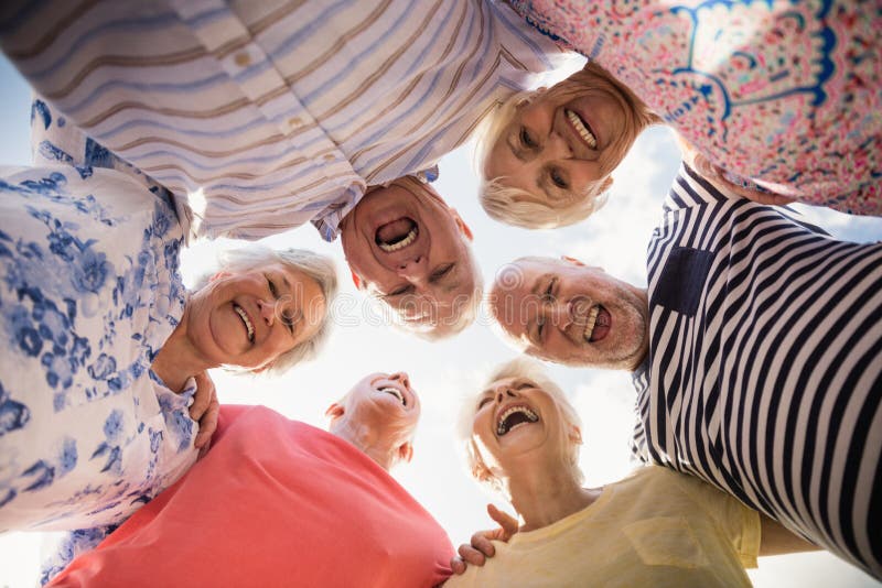 Senior Friends Standing in Circle Stock Photo - Image of friendliness ...