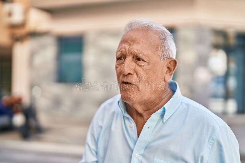 Senior Grey-haired Man with Relaxed Expression Standing at Street Stock ...