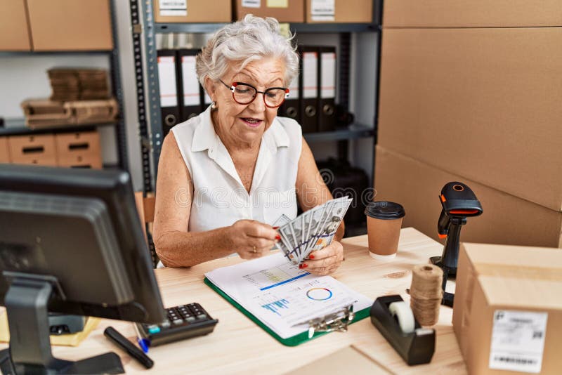 Senior Grey-haired Woman Business Worker Counting Dollars at Office ...
