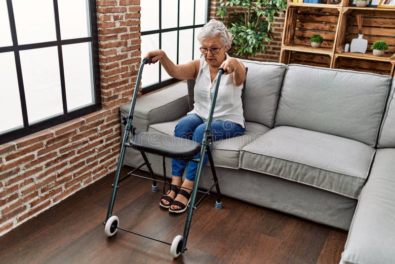 Senior Grey-haired Woman Patient Supported for Walker at Geriatric ...