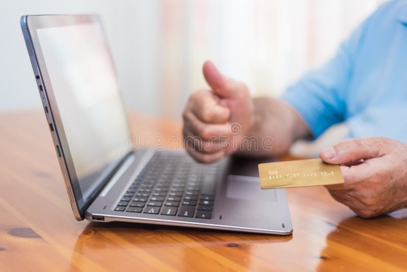 Senior Hands Holding Credit Card Using Laptop. Online Shopping Stock ...