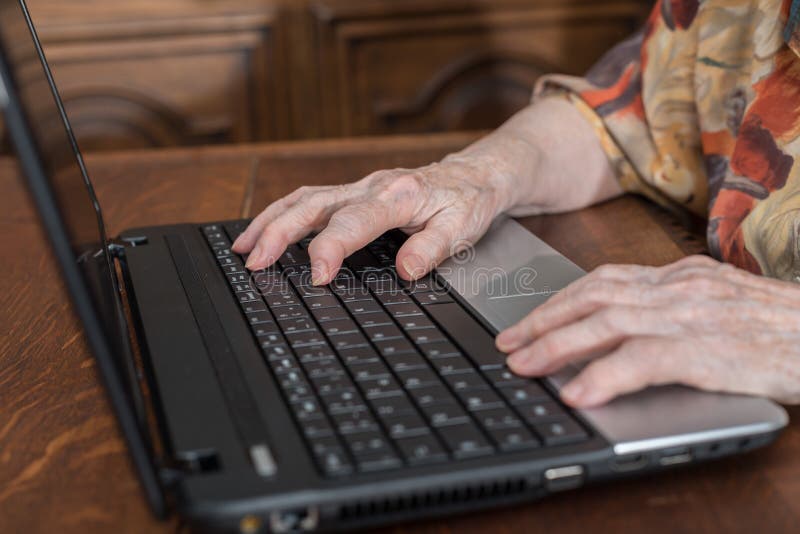 Senior Hands Typing on a Laptop Keyboard Stock Photo - Image of ...