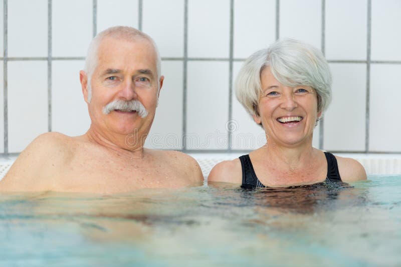 Senior Happy Couple in Swimming Pool Stock Image - Image of happy ...
