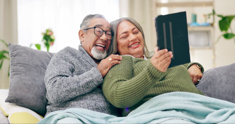 Senior Happy Couple Tablet And Couch With Laugh In Home For Video