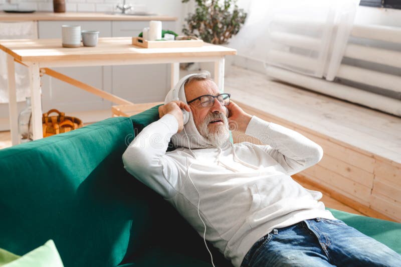 Senior Hipster Man Using Phone while Listening Playlist Music on Mobile ... Senior Hipster Man Using Phone while Listening Playlist Music on Mobile ...