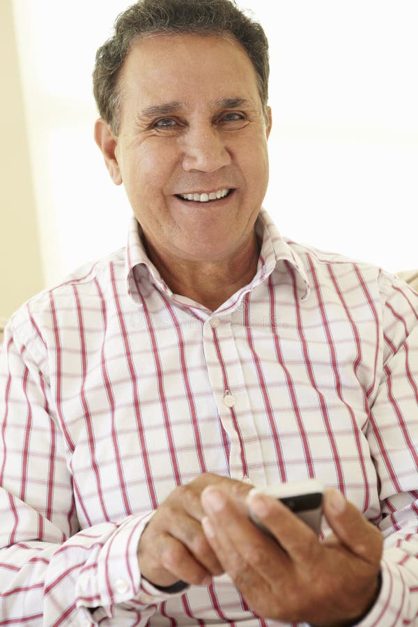 Senior Hispanic Man Using Smartphone Stock Image - Image of cell ...