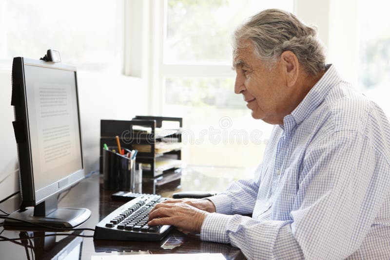 Senior Hispanic Man Working on Computer at Home Stock Photo - Image of ...