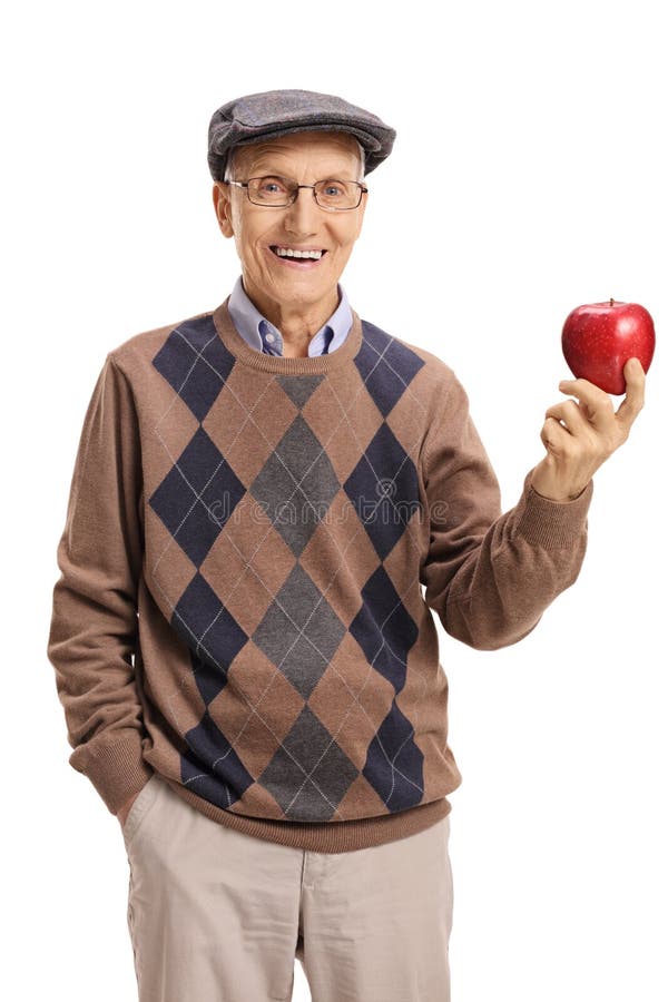 Senior holding an apple stock photo. Image of holding - 93792924