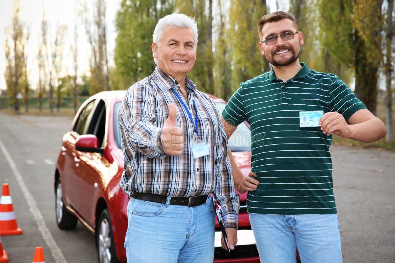 Senior Instructor and Happy Man with Driving License Stock Photo ...