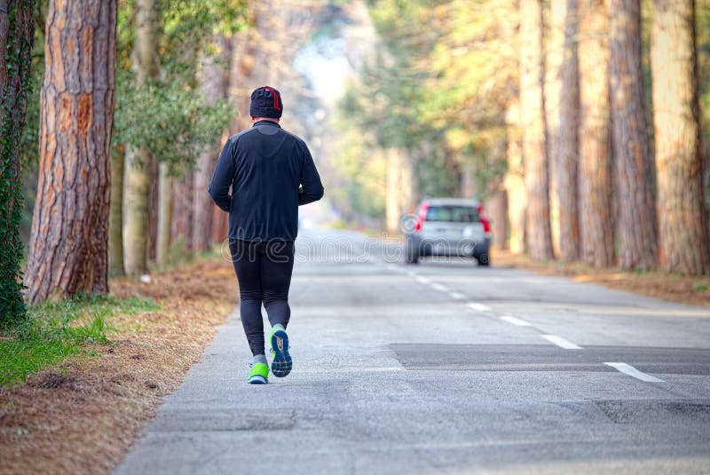 Senior Jogging To Keep Fit on the Tree-lined Street Stock Image - Image ...