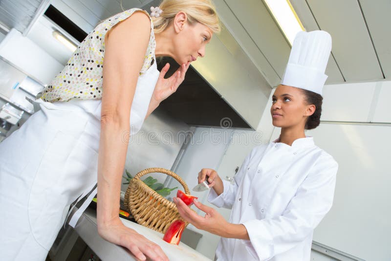 Senior and Junior Chefs in Discussion Stock Image - Image of adult ...