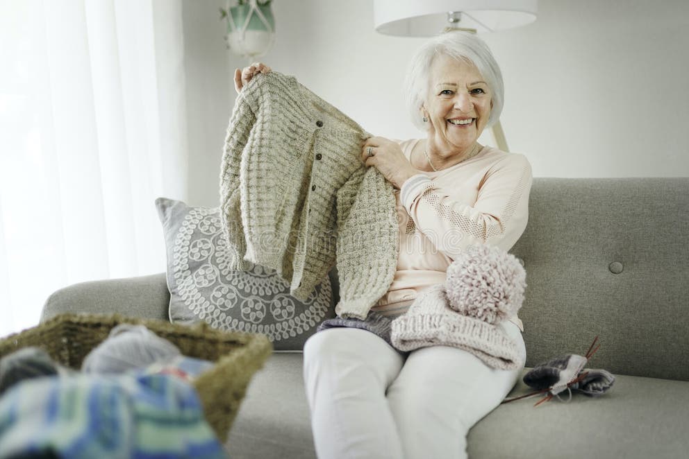 Senior Knitting on Her Sofa at Home Stock Image - Image of face, female ...