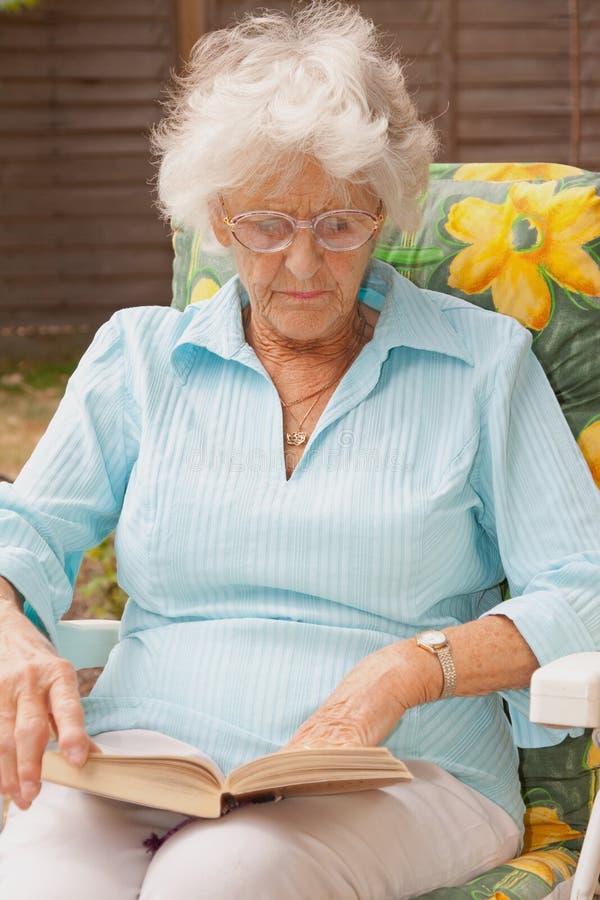 Senior Lady Reading in the Garden Stock Photo - Image of person ...