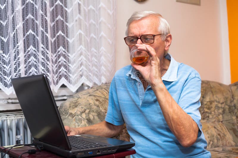 Senior with Laptop and Glass of Whiskey Stock Photo - Image of brandy ...