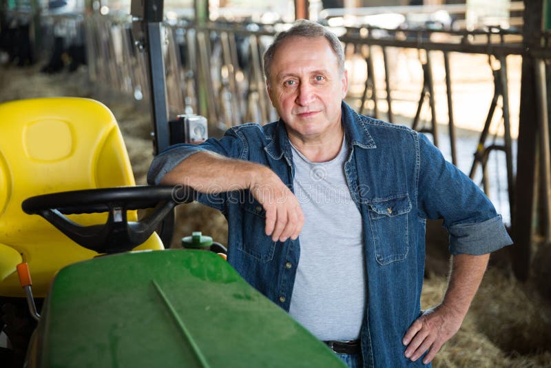 Senior Male Farmer in Tractor Stock Photo - Image of cabin, agriculture ...