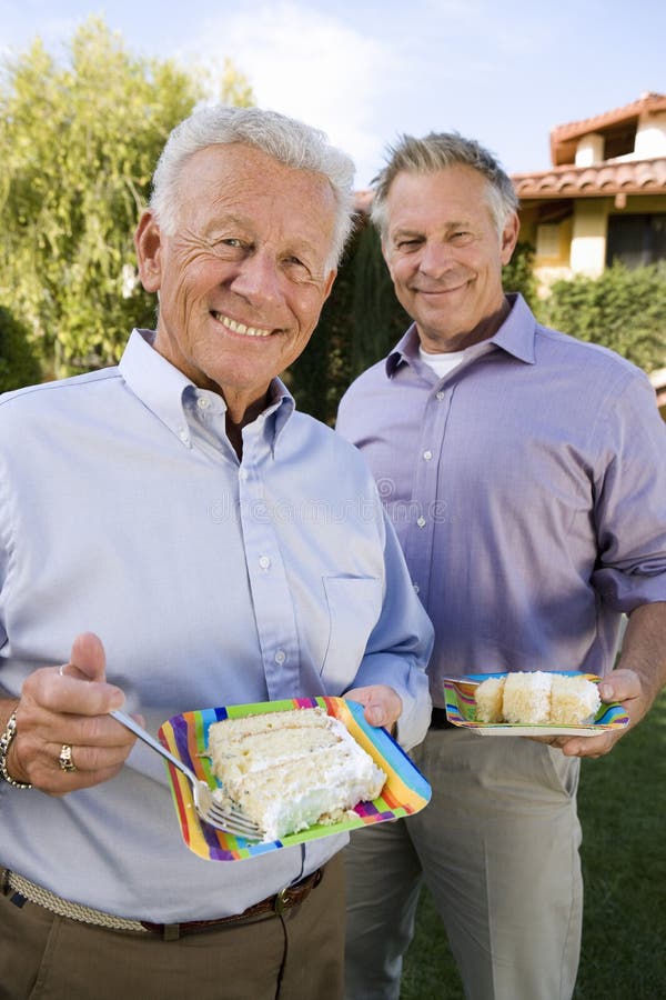 Senior Male Friends Eating Cake Stock Image - Image of cake, hungry ...