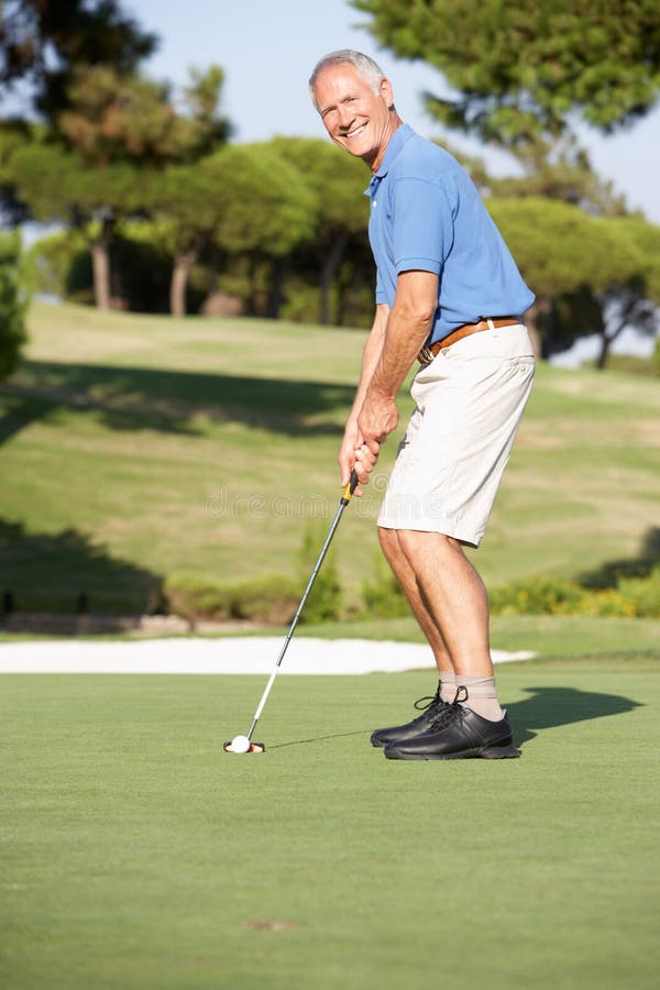 Senior Male Golfer on Golf Course Stock Image - Image of short, sinking ...