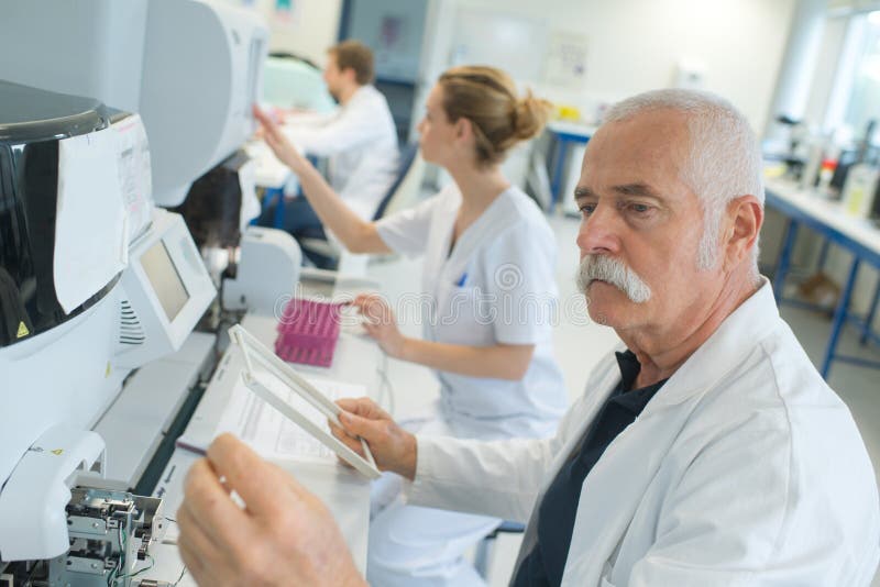 Senior Male Laboratory Worker Using Equipment Stock Photo - Image of ...