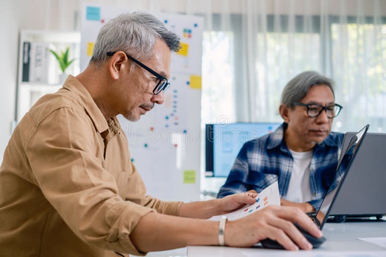 Senior Male Participating in a Computer Programming Bootcamp, Improving Skills and Learning ...