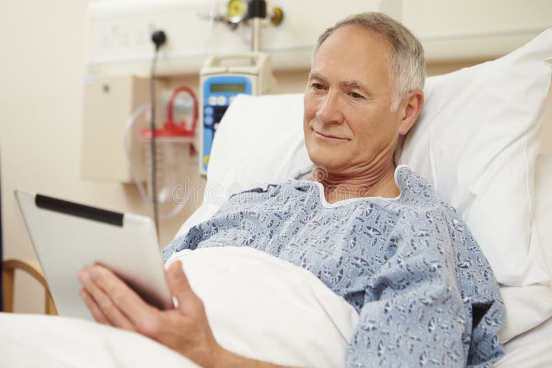 Senior Male Patient Using Digital Tablet in Hospital Bed Stock Photo ...