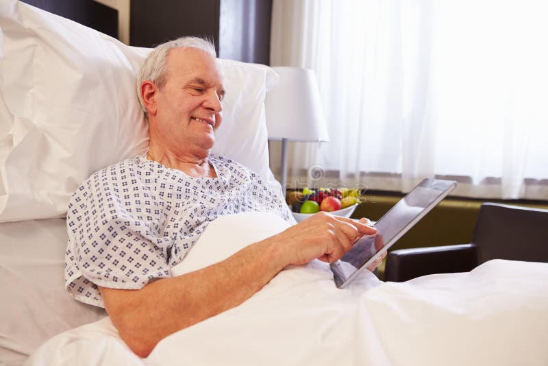 Senior Male Patient Using Digital Tablet in Hospital Bed Stock Photo ...