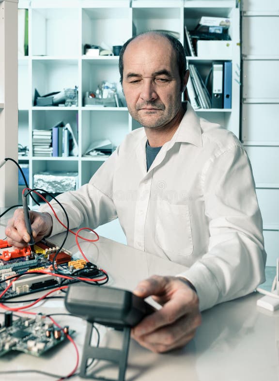 Senior Male Tech Fixes Epectronics Stock Image - Image of hardware ...