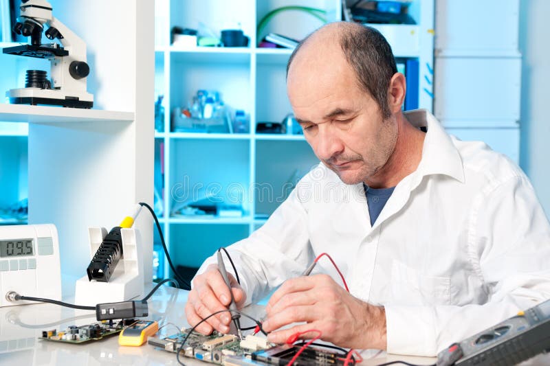 Senior Male Tech Repairs Circuit Board Stock Image - Image of equipment ...